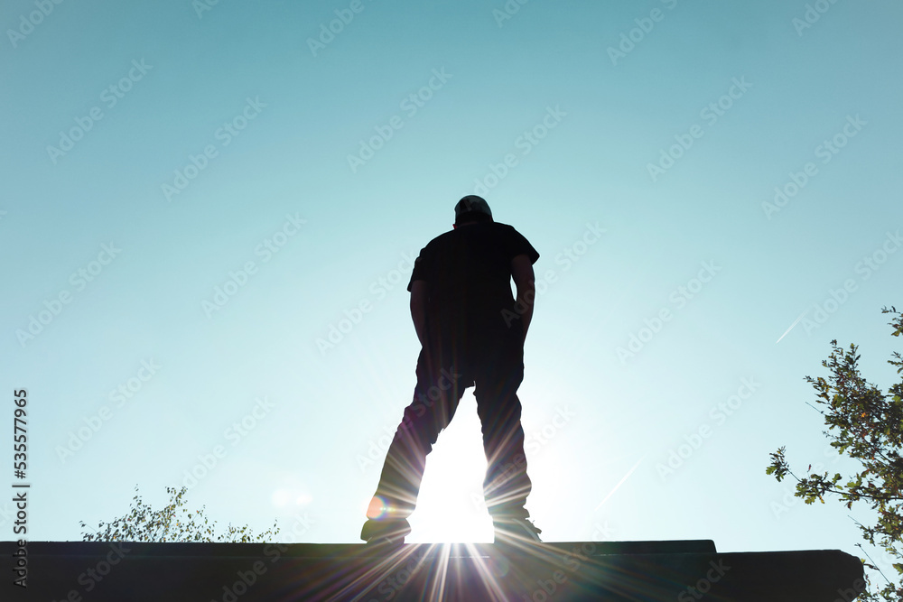 man silhouette portrait and blue sky background Stock Photo | Adobe Stock