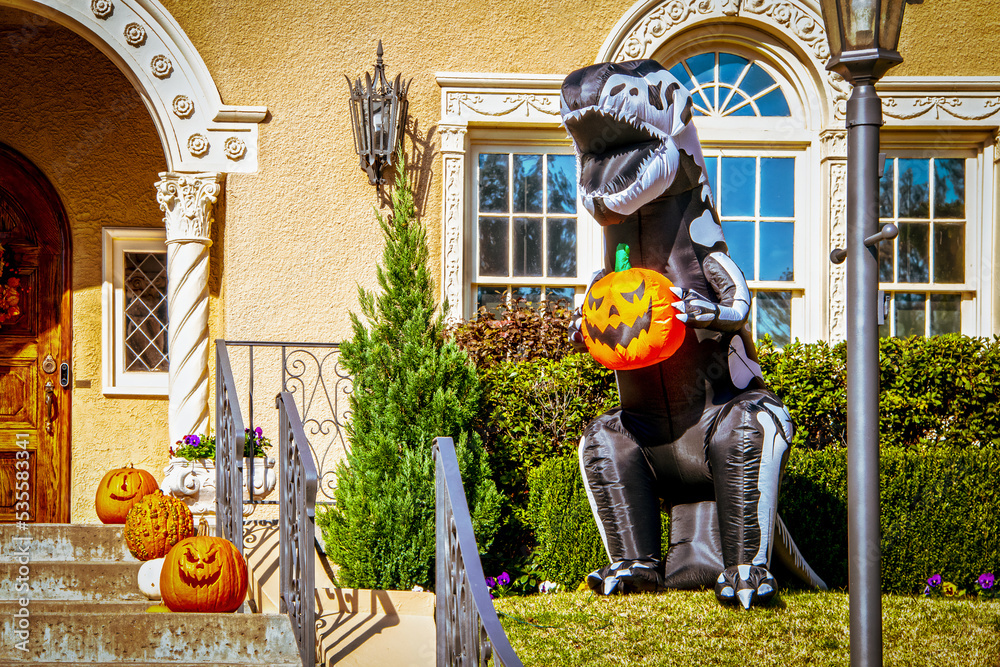 Giant Halloween inflatable skeleton dinosaur roaring and holding ...