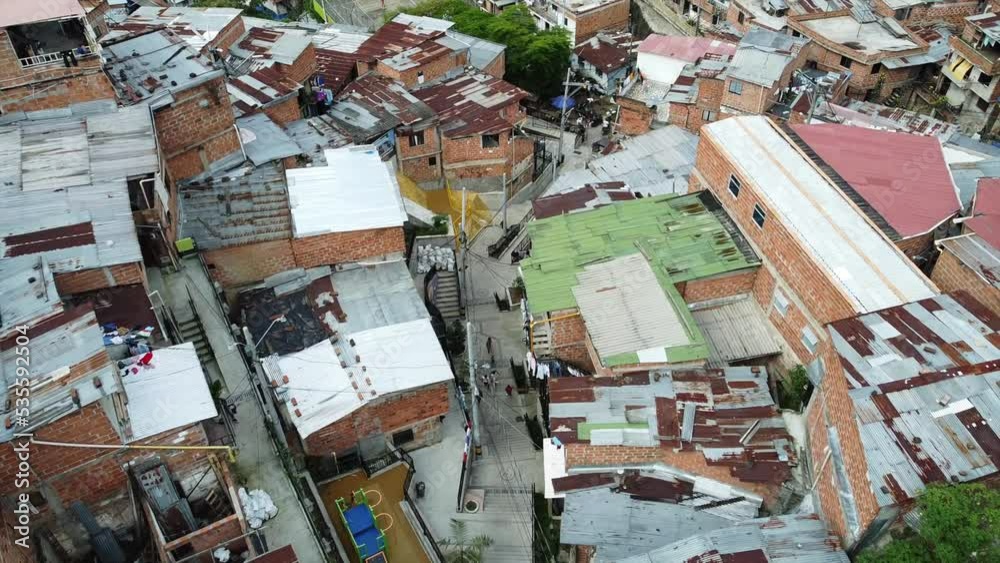 Medellin, Colombia, drone aerial view of Comuna 13 slums, favela. Once ...