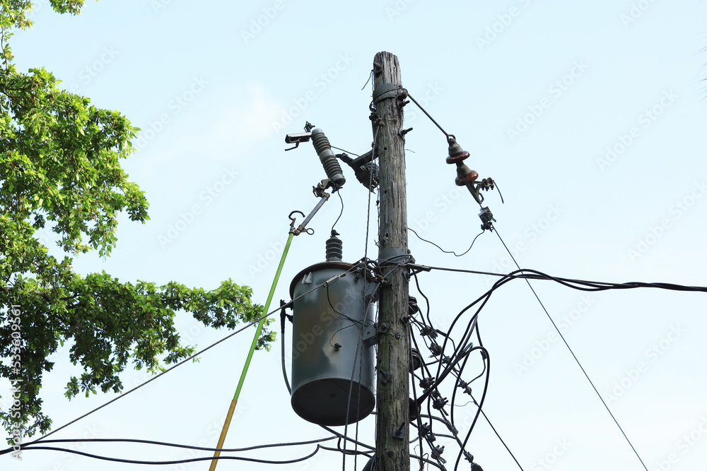 Electrical worker (out of sight) using a loadbreak pole reconnects the ...