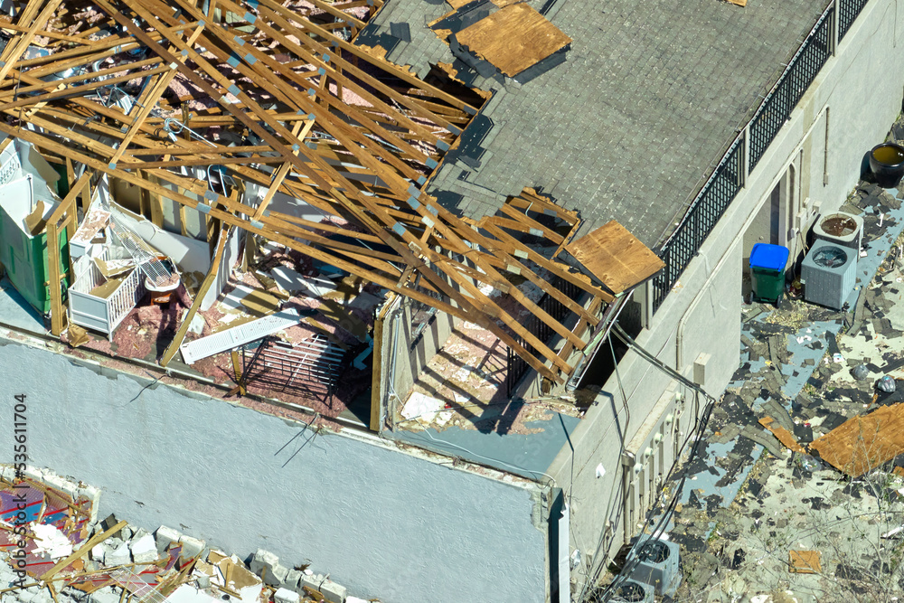 Hurricane Ian destroyed house roof in Florida residential area. Natural ...
