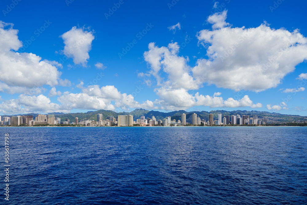 Wide panoramic view of Honolulu as seen from a boat off Waikiki in ...