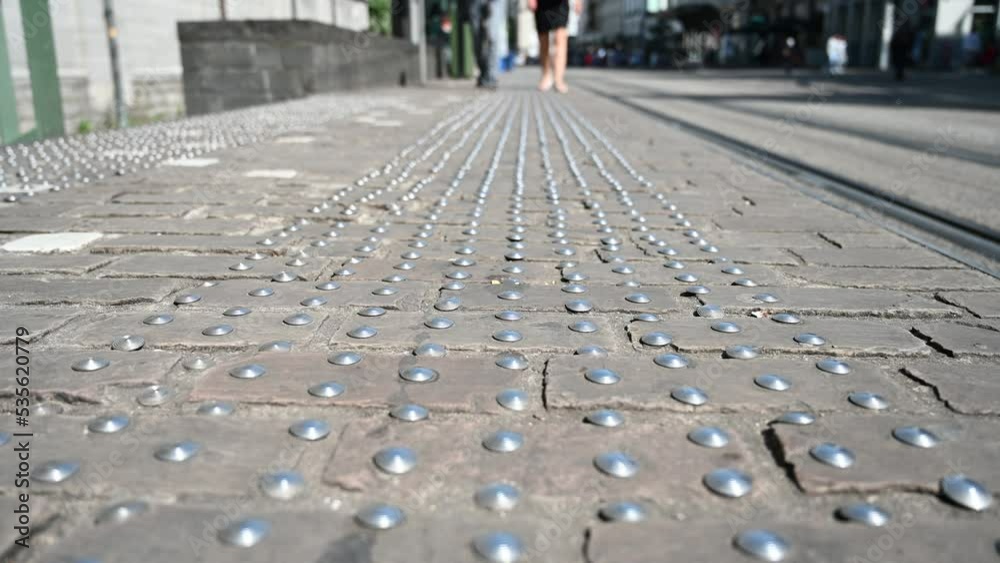 Video Stock People walking on tactile paving on sidewalk in the city ...