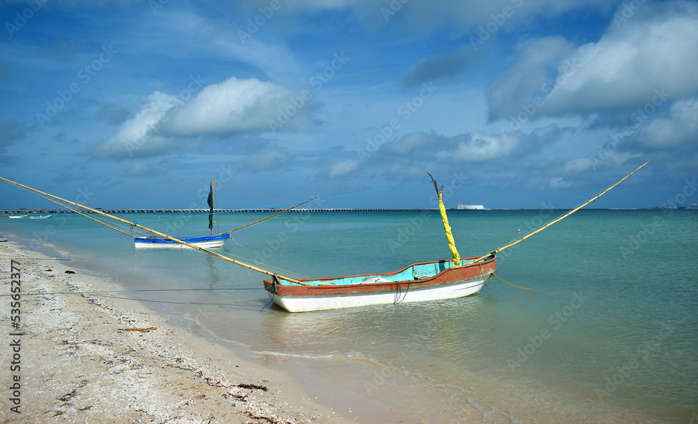 Fishing boat anchored on the coast, beach near the city of Progreso in ...
