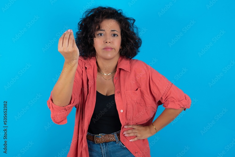What the hell are you talking about. Shot of frustrated young beautiful ...