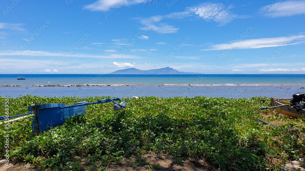 Traditional wooden fishing canoe boats on the waterfront of Dili, Timor ...