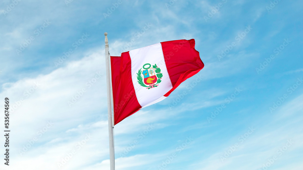 Bandera peruana ondeando en el cielo azul Stock Photo | Adobe Stock