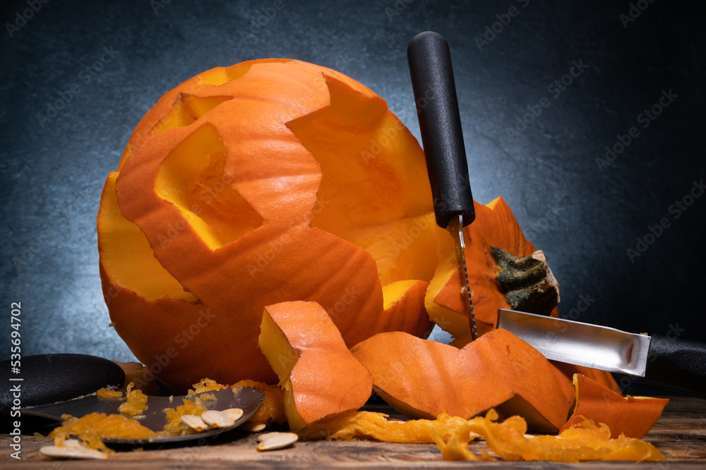 Halloween pumpkin gutting and carving Jack-o'-lantern. Guts and seeds ...