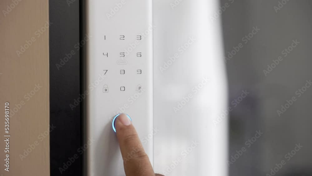 Close Up Footage of Man's hand opens the electronic digital door with a ...