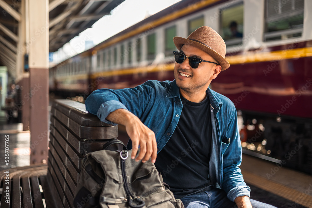 Freedom traveler young asian man at terminal train station. Happy ...