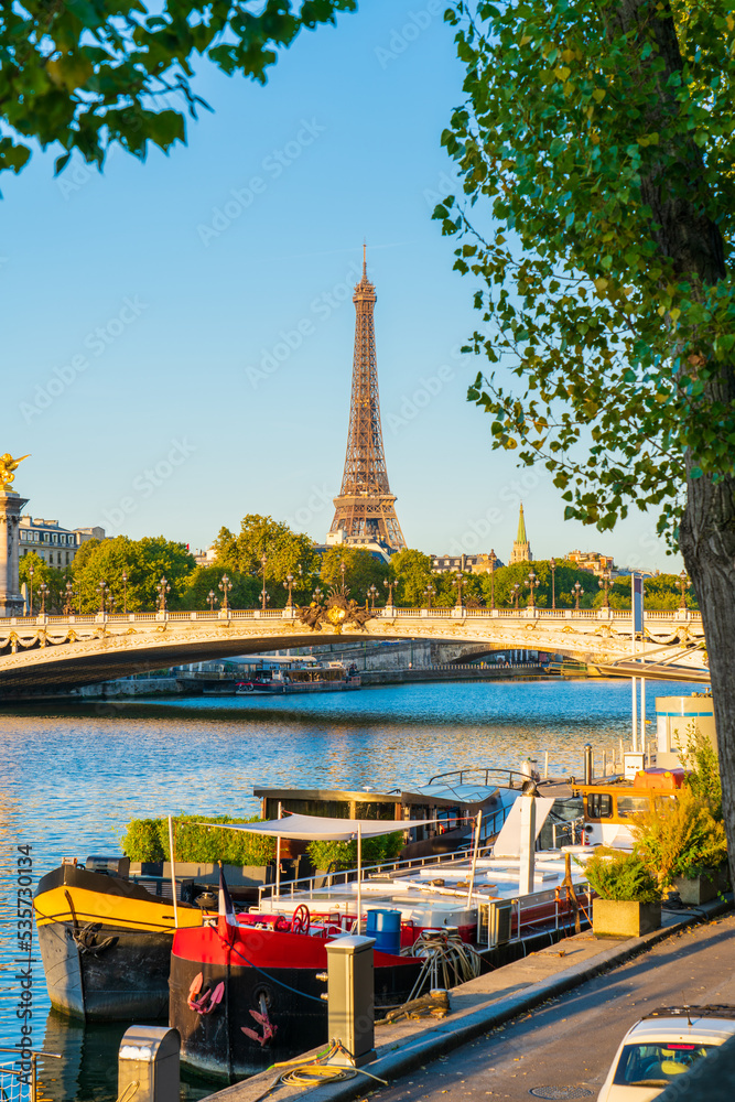 Scenic riverside view of Eiffel Tower behind Alexandre III bridge in ...