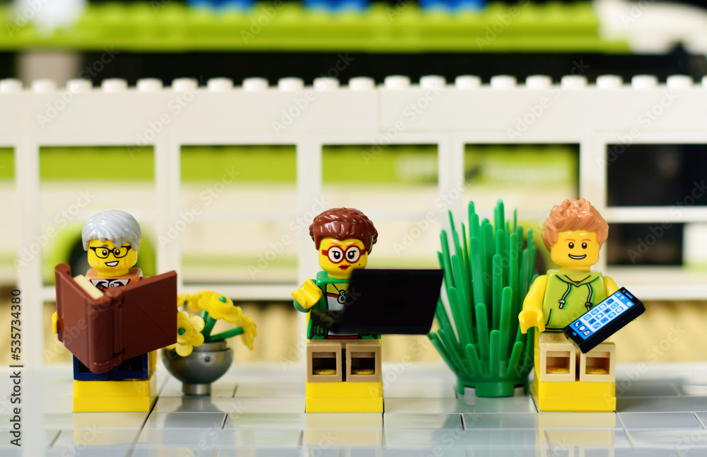 Lego minifigures as people in different age with book, laptop ...