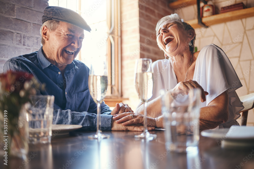 Love, laughing and old couple holding hands at a restaurant on a ...