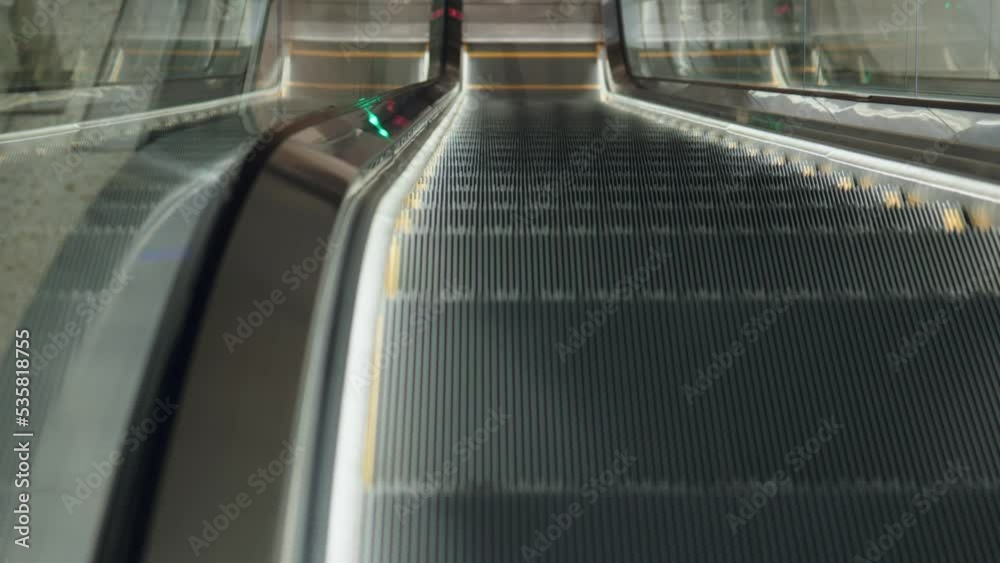 metal steel escalator stairs moving up and down empty elevator walkway ...
