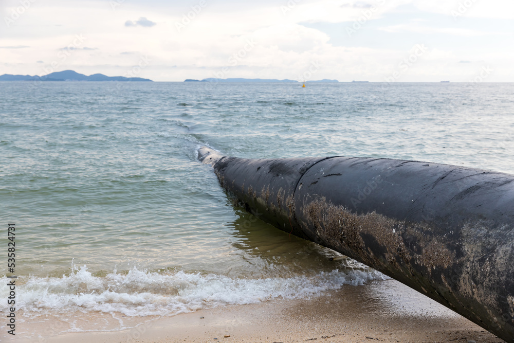 Water pipe going into the Atlantic ocean. Sea water intake pipe at the ...