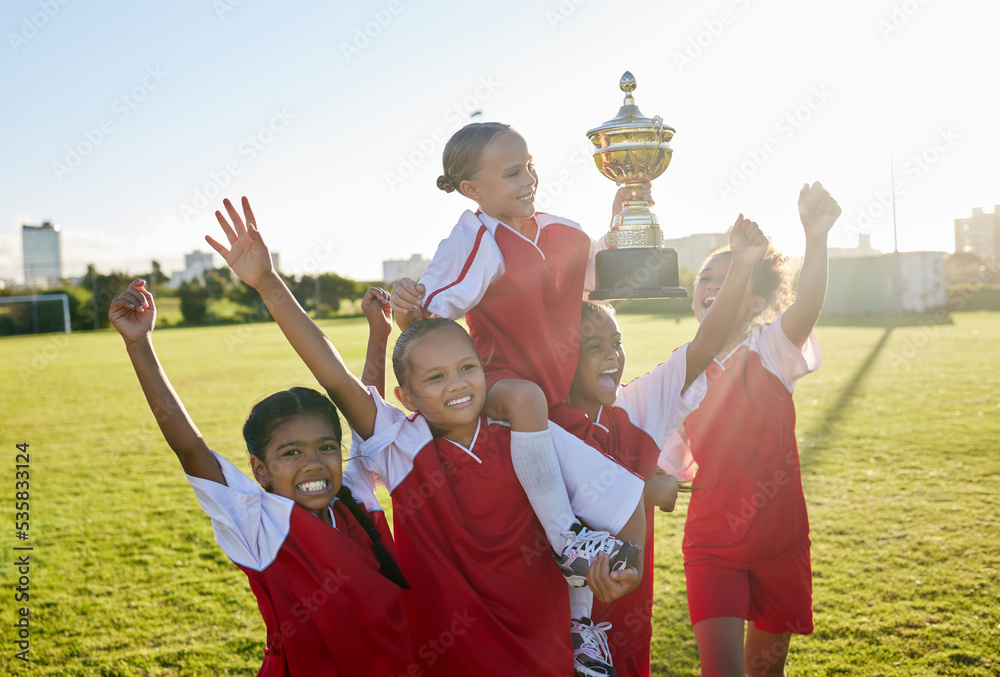 Sports. soccer and young girls with trophy celebrate, happy and excited ...
