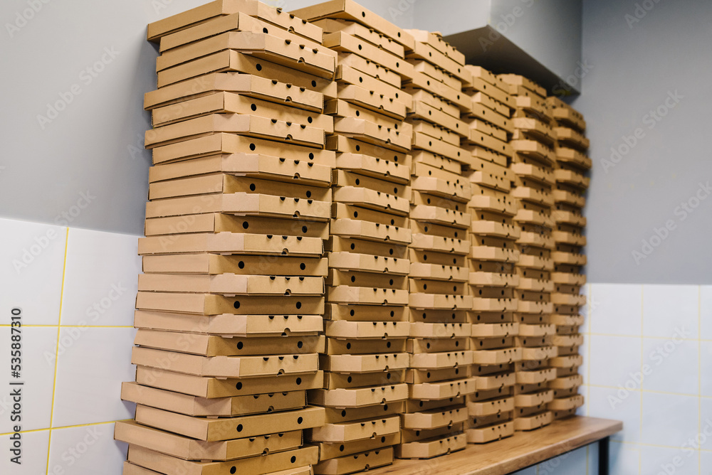 Stack of pizza boxes. Cardboard brown boxes for shipping and delivery ...