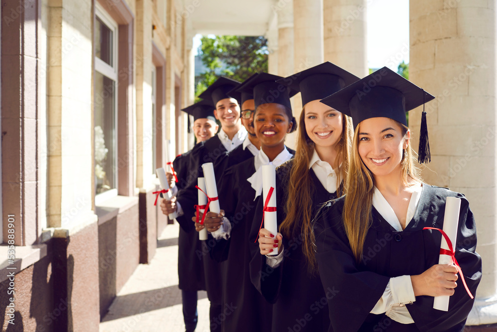 Graduation. Portrait of happy female and male university graduates ...