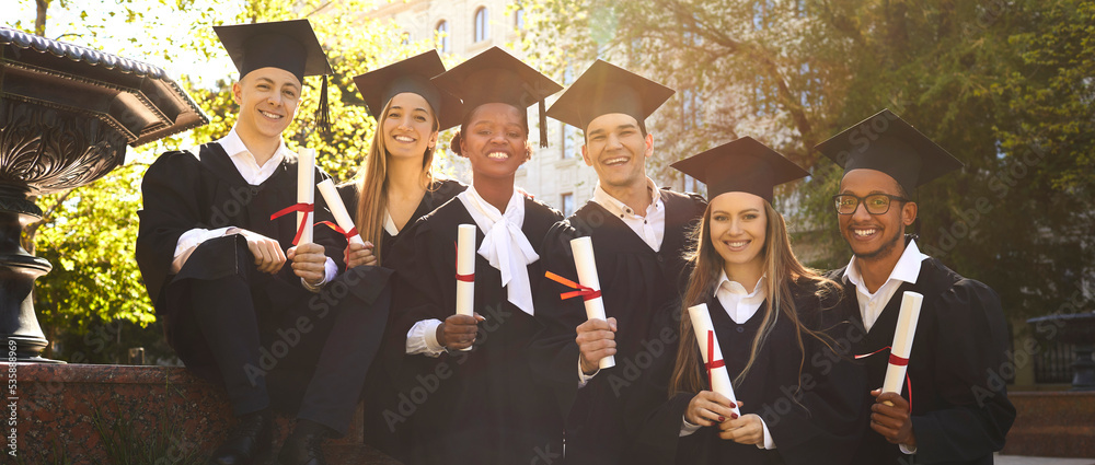 Graduation. Portrait of joyful group of multiracial students who ...