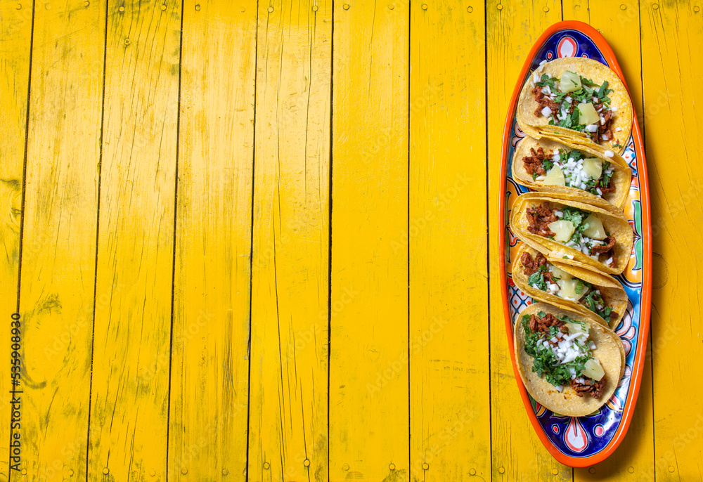 Mexican background with tacos al pastor and mexican sauces. Yellow ...