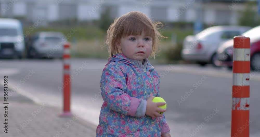 Portrait of a lost child. Toddler girl alone without parents on the ...
