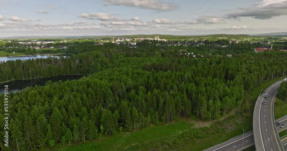 Jessheim Norway v3 cinematic drone flyover freeway towards suburban ...