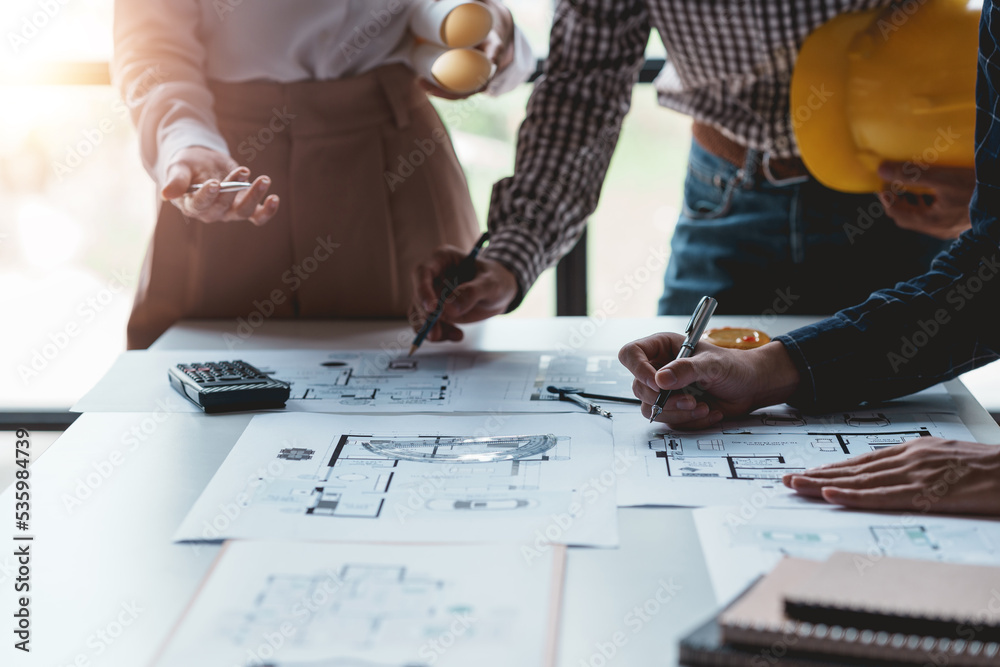 Project planning meetings with engineer or architect working together ...