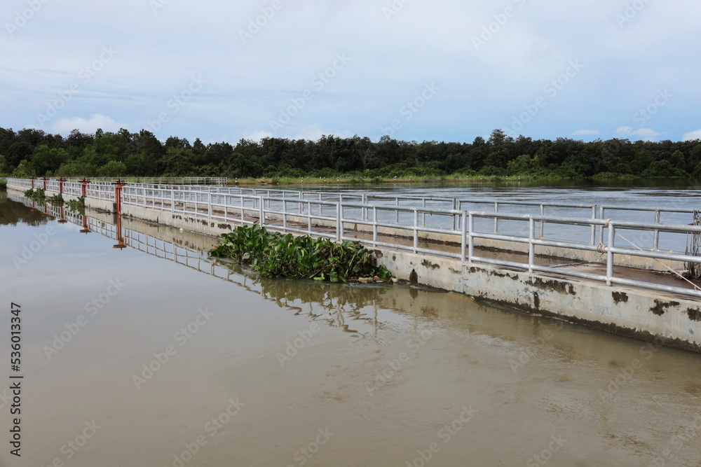 High water level and small bridge. Critical flooding of rivers and ...