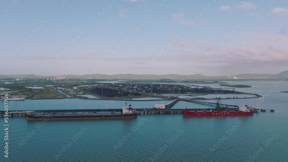Aerial high angle drone footage of bulk carrier cargo ships docked at ...