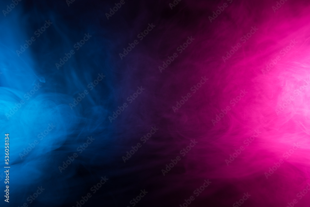 Colorful smoke clouds in neon light swirling on empty scene dark ...