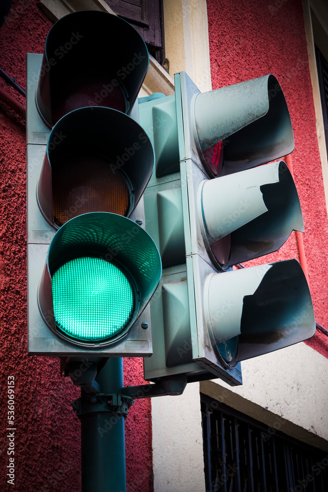 Green go light on traffic light on street corner Stock Photo | Adobe Stock