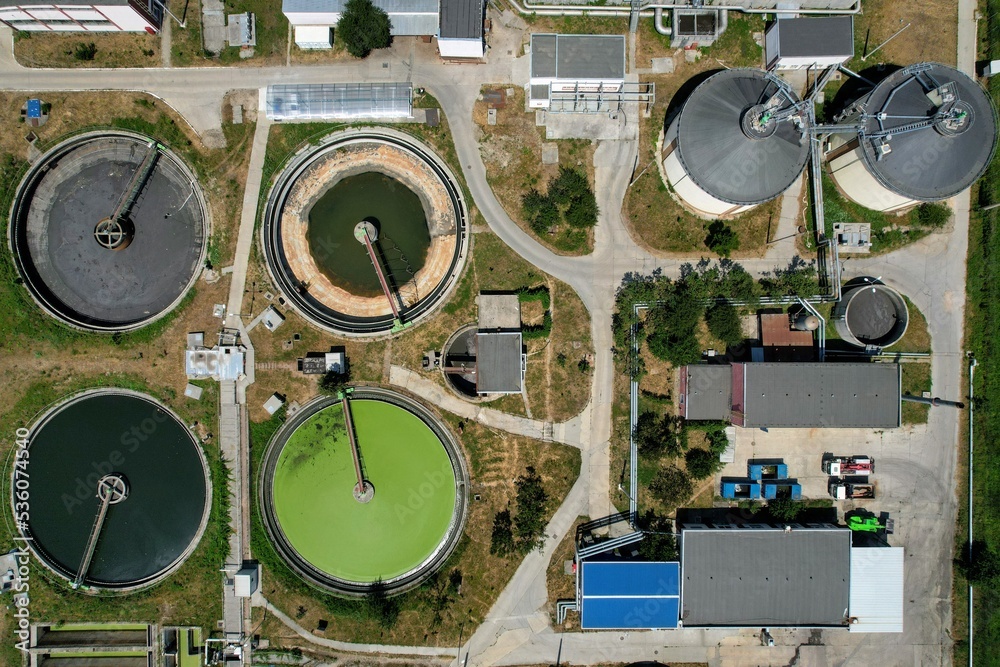 Aerial top down view of primary sedimentation tanks, large circular ...