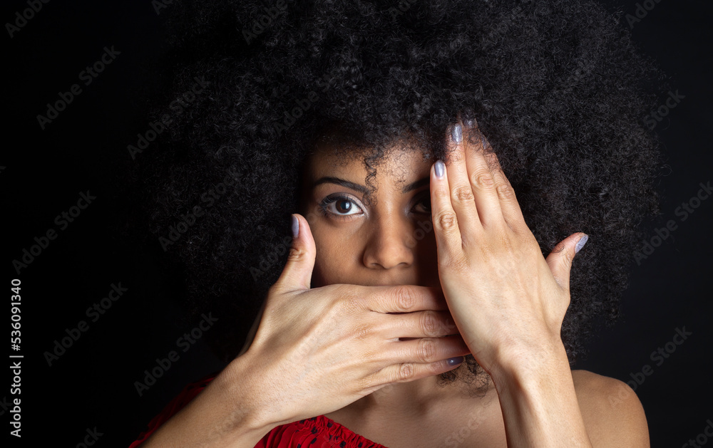 Shy ethnic woman covering face on black background Stock Photo | Adobe ...