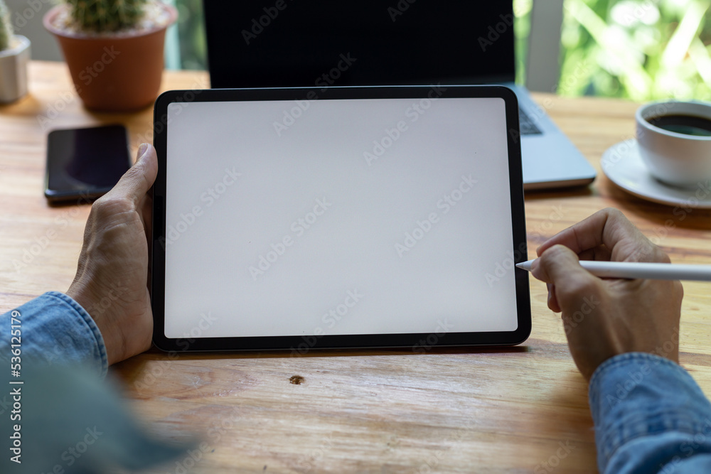 mock up empty screen tablet, businessman working on his tablet with ...