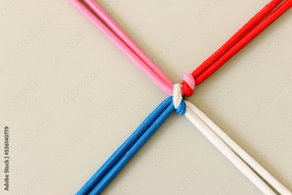 Concept image of unity and teamwork. Ropes tied together as a symbol of ...