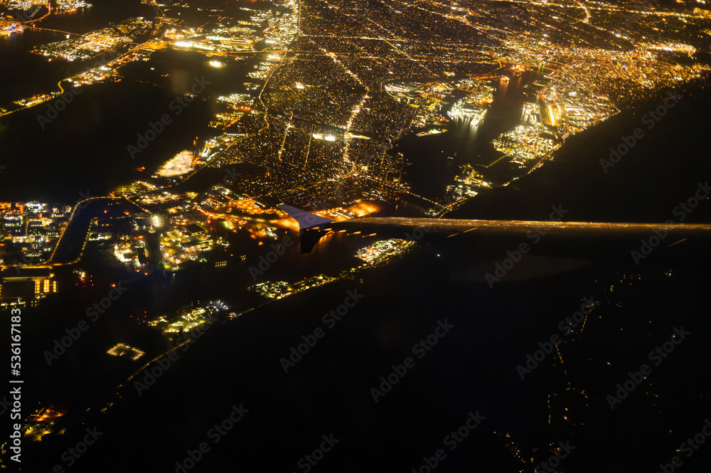 Fantastic view of the city at night, illuminated by golden lights from ...