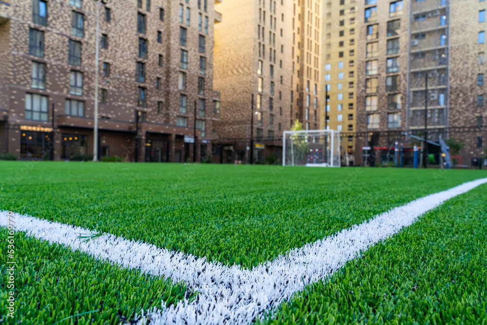 Soccer field at the school stadium in residential area. Outer line in ...