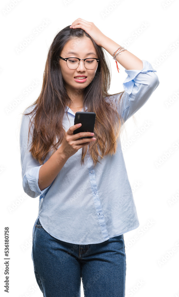 Young asian woman texting using smartphone over isolated background ...