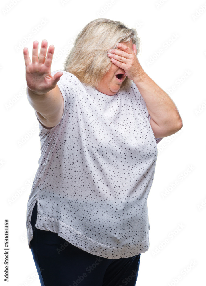 Senior plus size caucasian woman over isolated background covering eyes ...