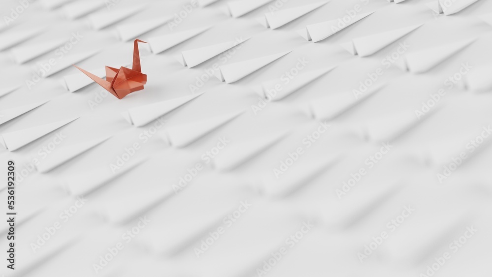 Origami of orange crane and many airplanes on white board under white ...