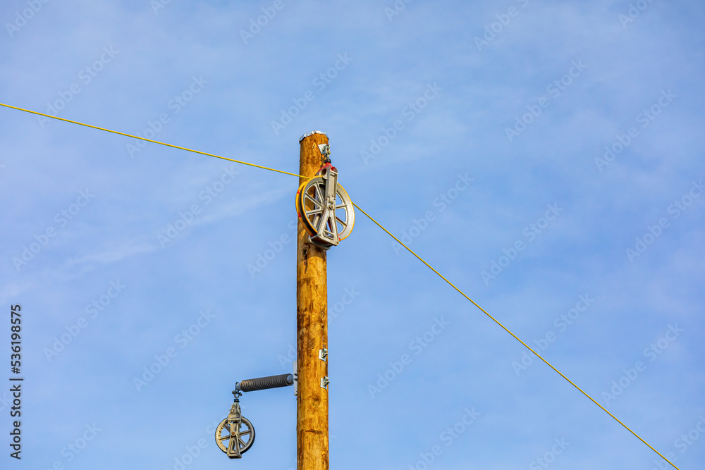 Utility power pole ready for electric line installation. Infrastructure ...