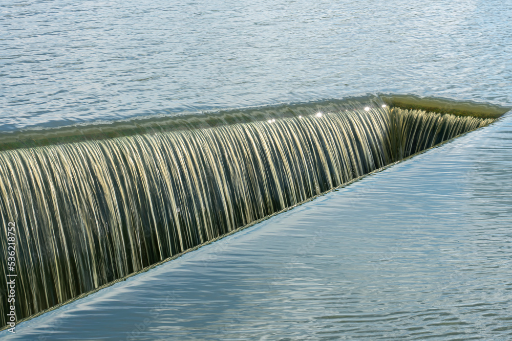 Water flowing in ditch inlet. Weir water stripes pattern,use for ...
