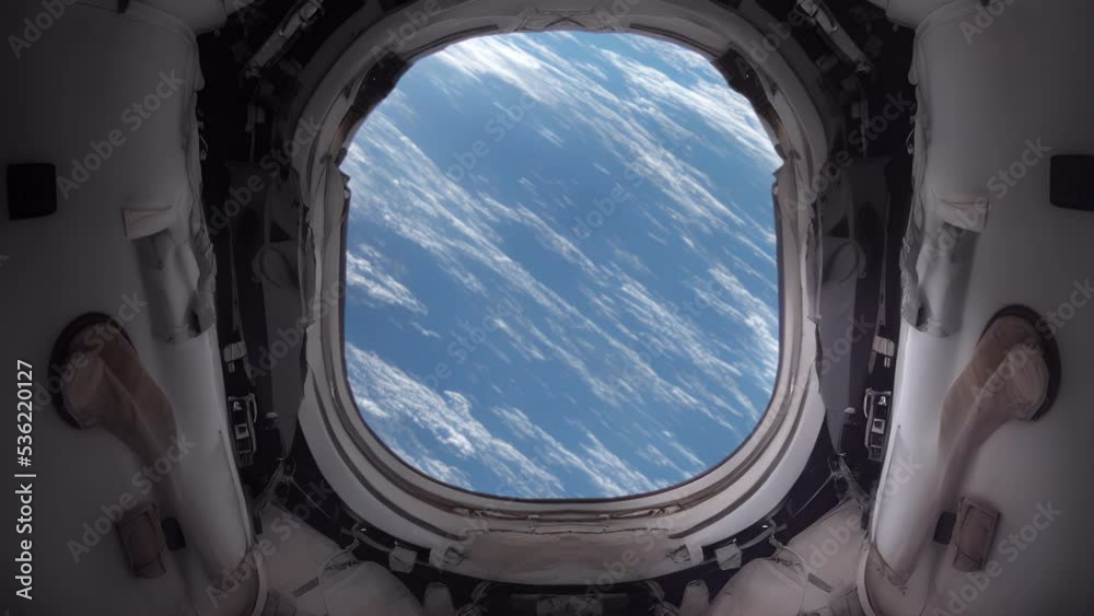 A view from the window of a spaceship escape pod looking down on the ...