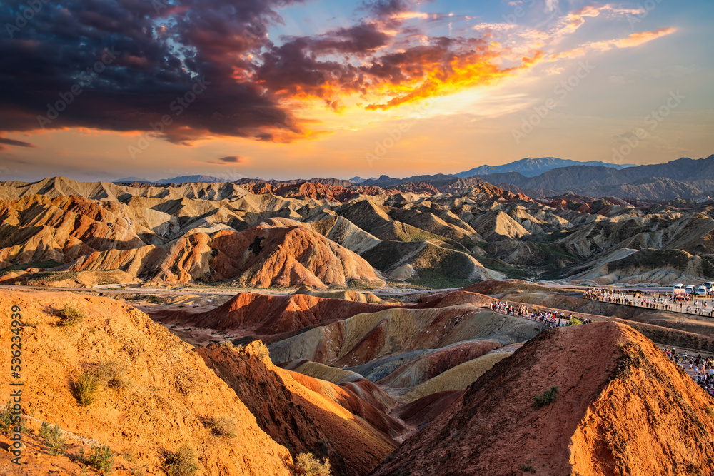 Colorful sunset at the badlands of the Danxia Landforms, between the ...