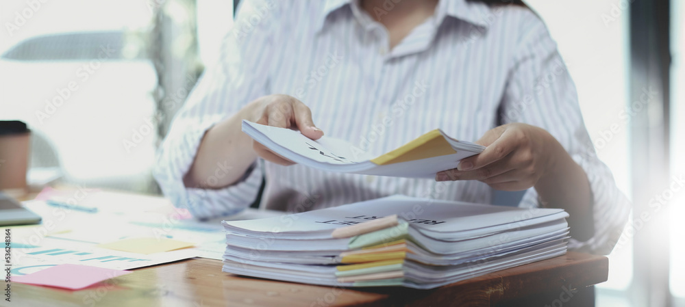 Business Documents concept : Employee woman hands working in Stacks ...
