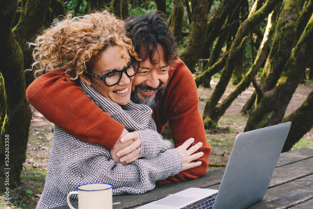 Happy couple in love and friendship enjoy video call on laptop together ...