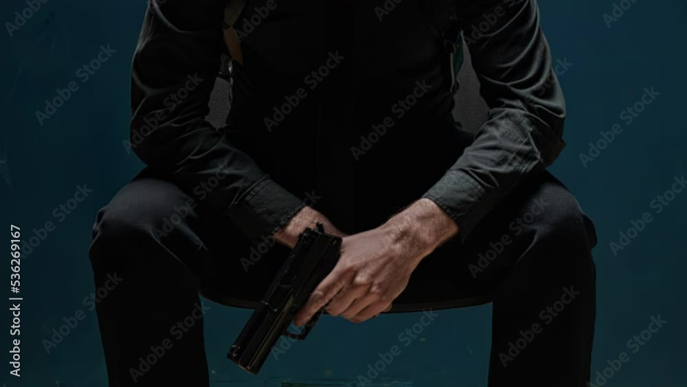 FBI agent holds service pistol in his hand. Police detective with gun ...