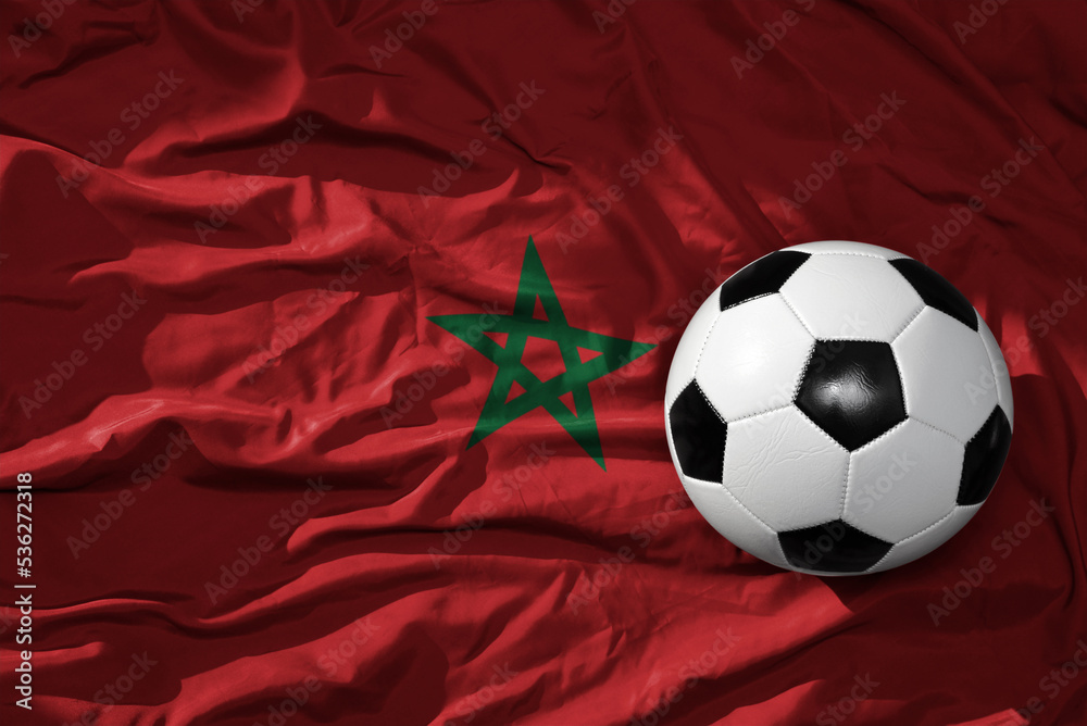 vintage football ball on the waveing national flag of morocco ...