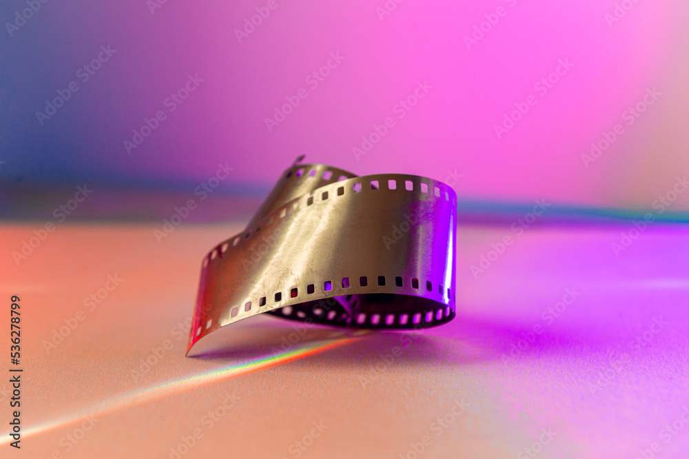 Gold film strips on beige background. Horizontal media theme poster ...