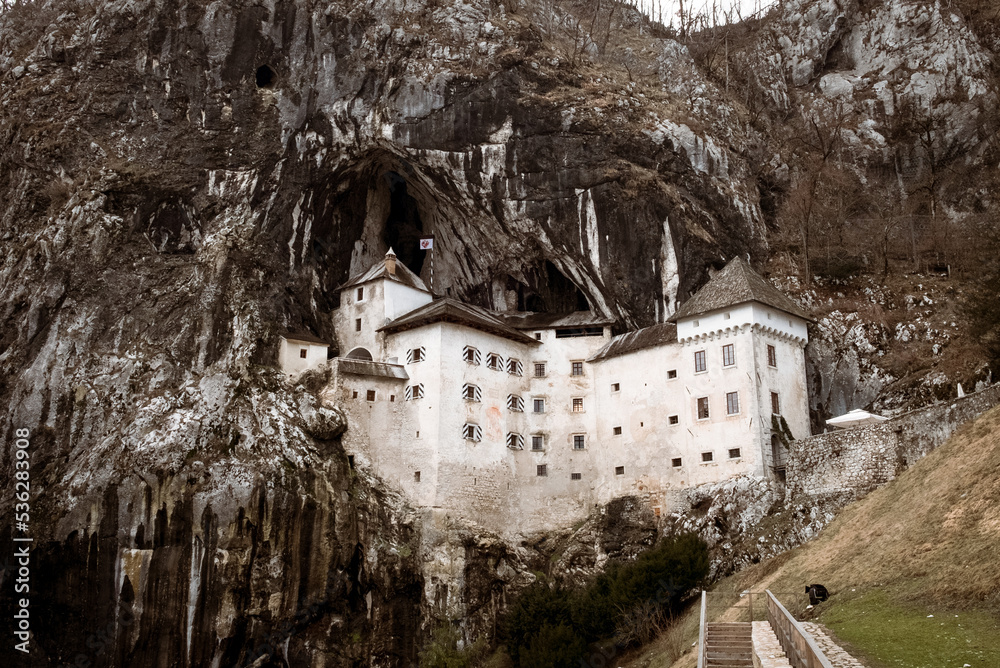 Predjama Castle, situated in the middle of a cliff near Postojna Cave ...